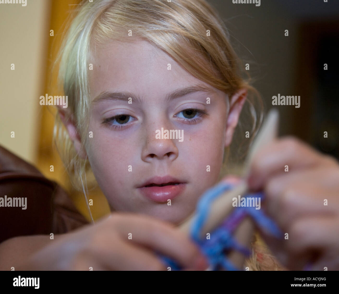Child knitting with yarn Stock Photo - Alamy