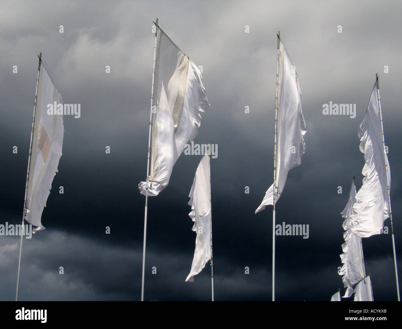 White flags are set off by a stormy sky at Womad music festival Reading ...