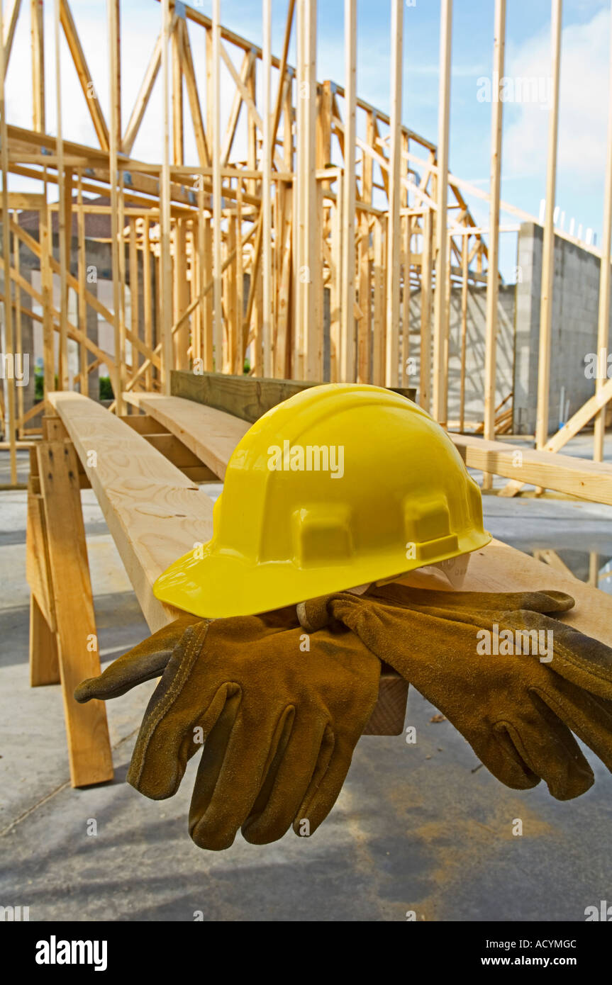 lumber stacked up at construction site for home building Stock Photo ...