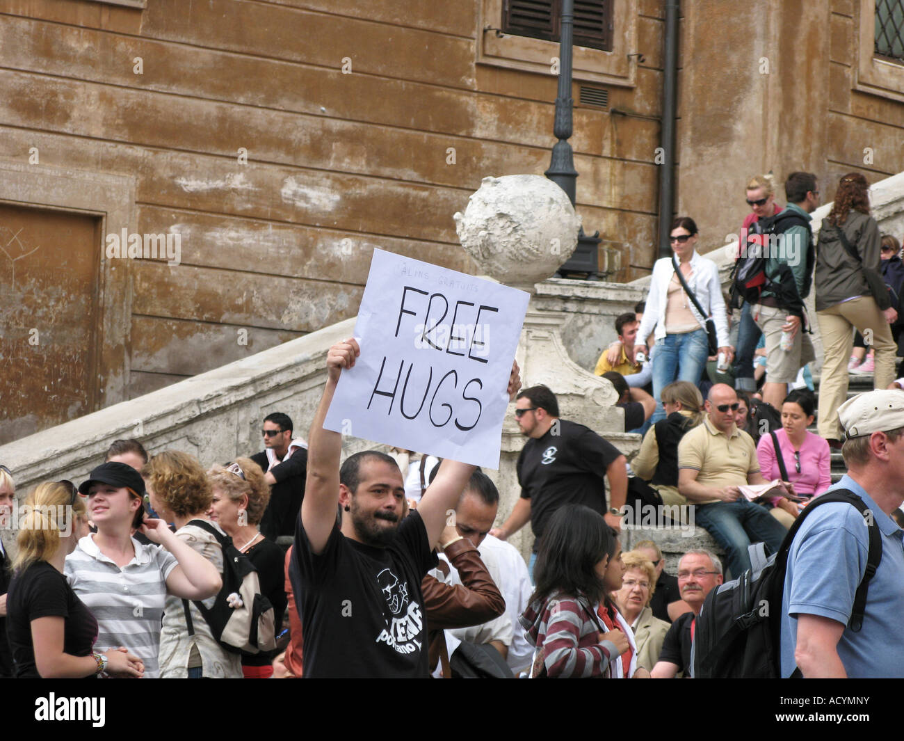 Man with sign giving away Free Hugs at the Spanish Steps Rome Italy ...
