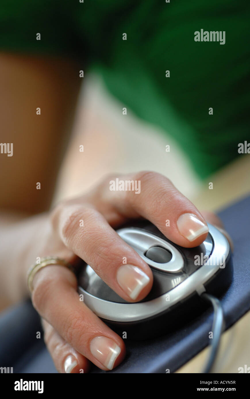 Womans hand using a computer mouse with scroll wheel in an office Stock ...