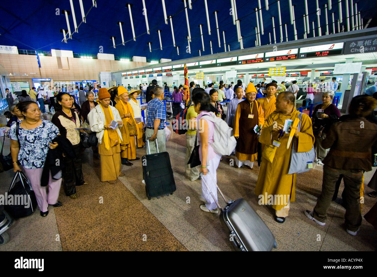 Buddhist monk in airport hi-res stock photography and images - Alamy