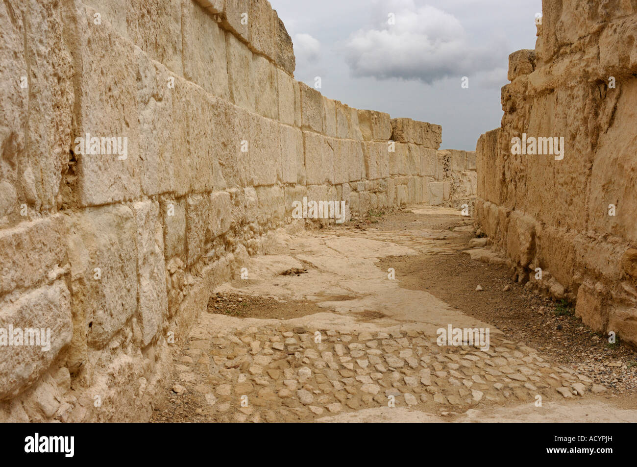 Way between two stone walls Kourion Archaeological Site Stock Photo - Alamy