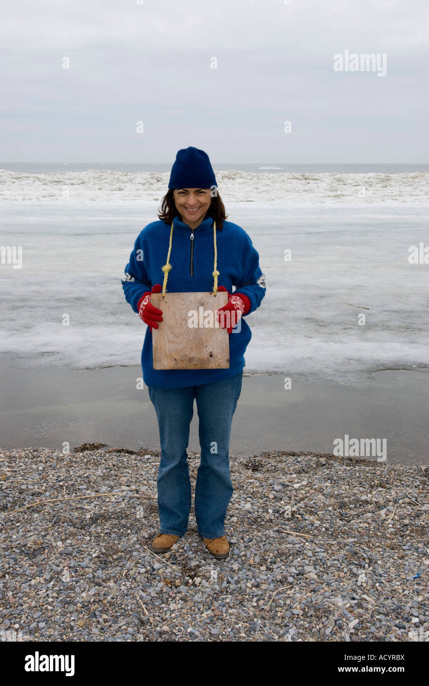 Woman wearing blank sign around her neck at Pt. Pelee National Park ...