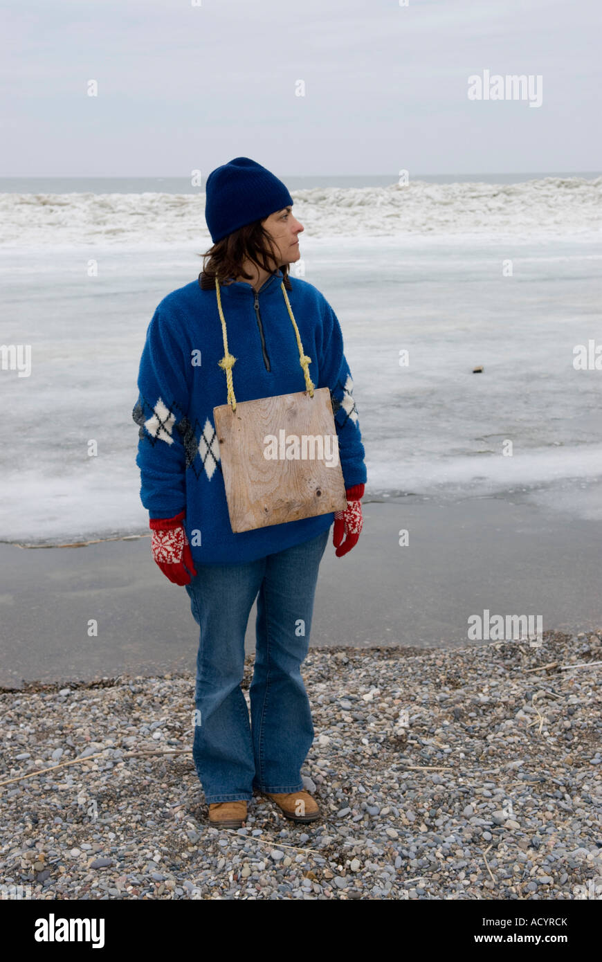 Woman wearing blank sign around her neck at Pt. Pelee National Park ...