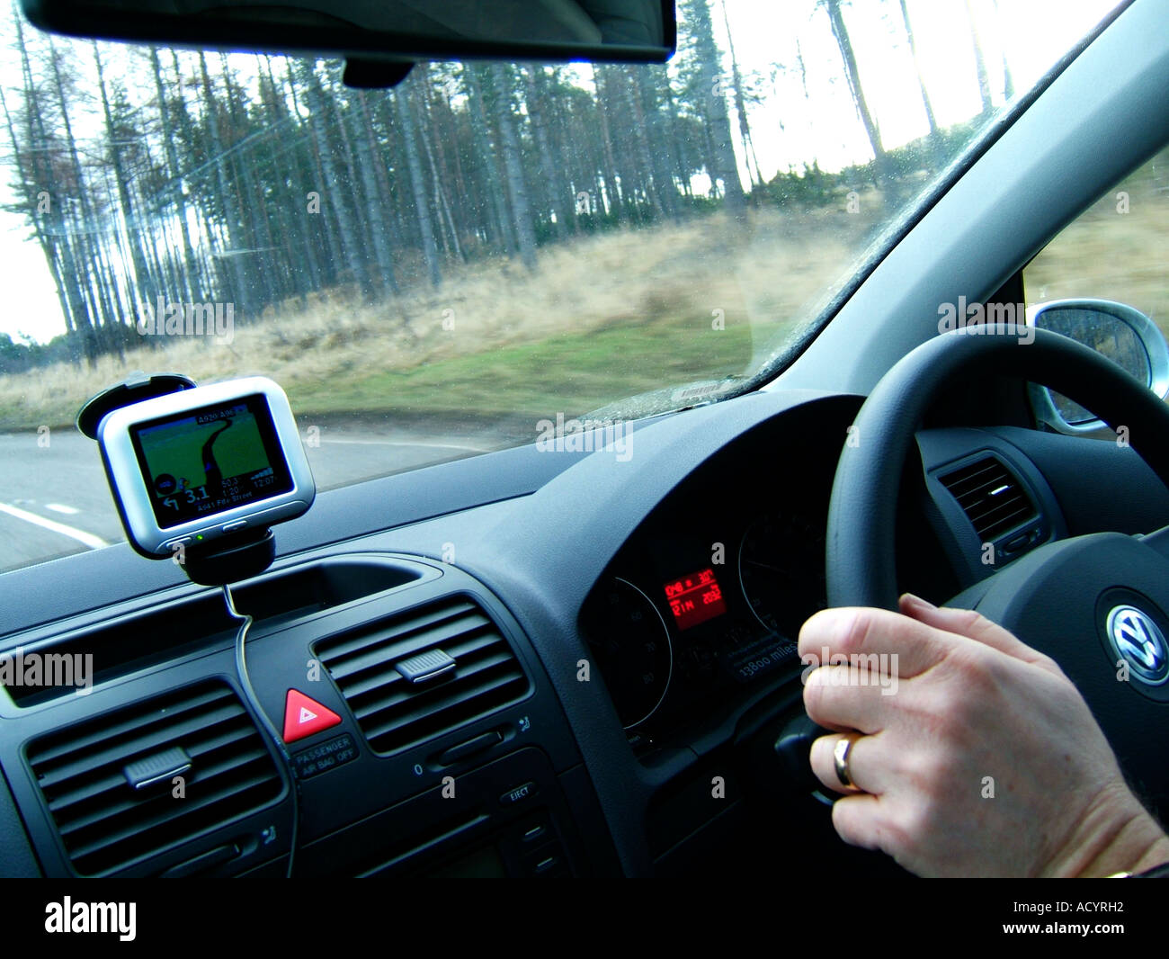 man driving with Sat Nav equipment Stock Photo - Alamy