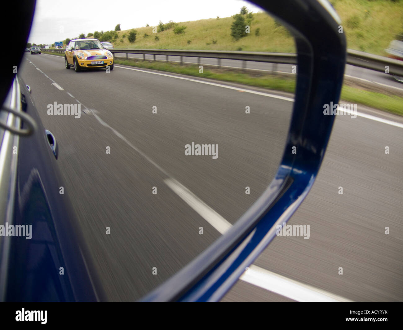 car overtaking on the motorway, seen through the wing mirror Stock ...