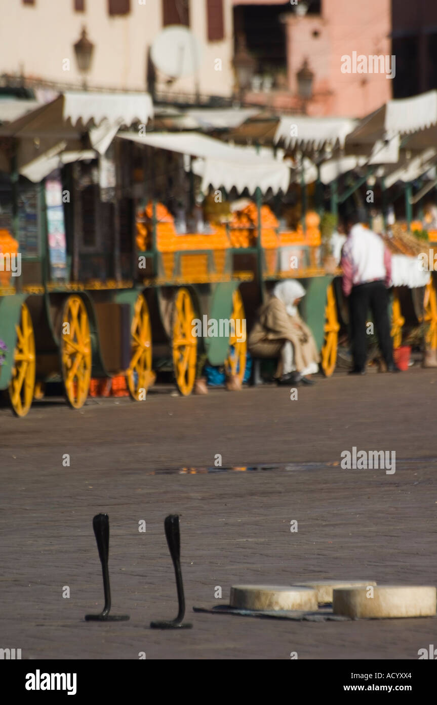 snake charmer and fruit stands in market Place Djema El Fna Marrakech ...