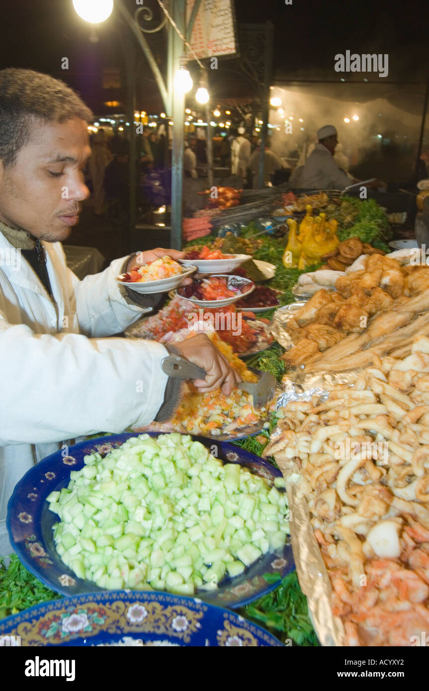 preparing and serving food colourful and exotic food stall at night ...