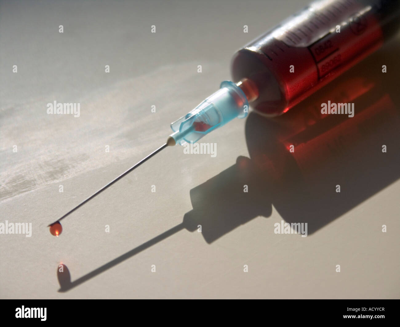 syringe blood on a white background Stock Photo - Alamy