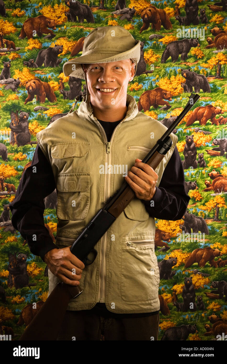 Mid adult Caucasian male holding a rifle Stock Photo - Alamy