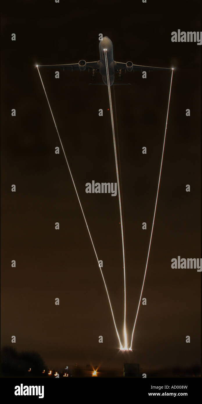 Airplane Night Landing Stock Photo - Alamy