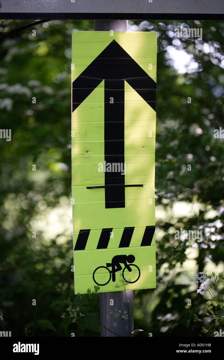 Bicycle race route direction sign Stock Photo - Alamy