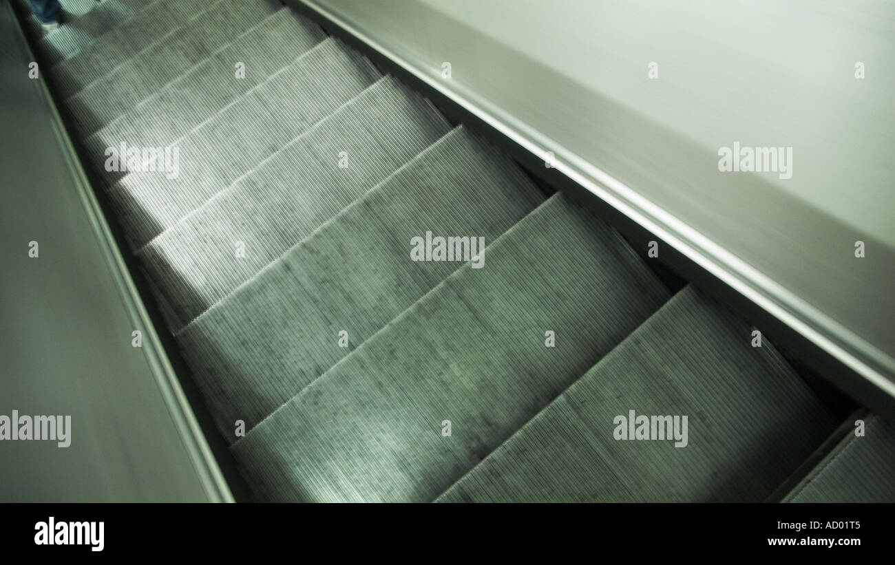 Escalator steps, silver colour metal Stock Photo - Alamy