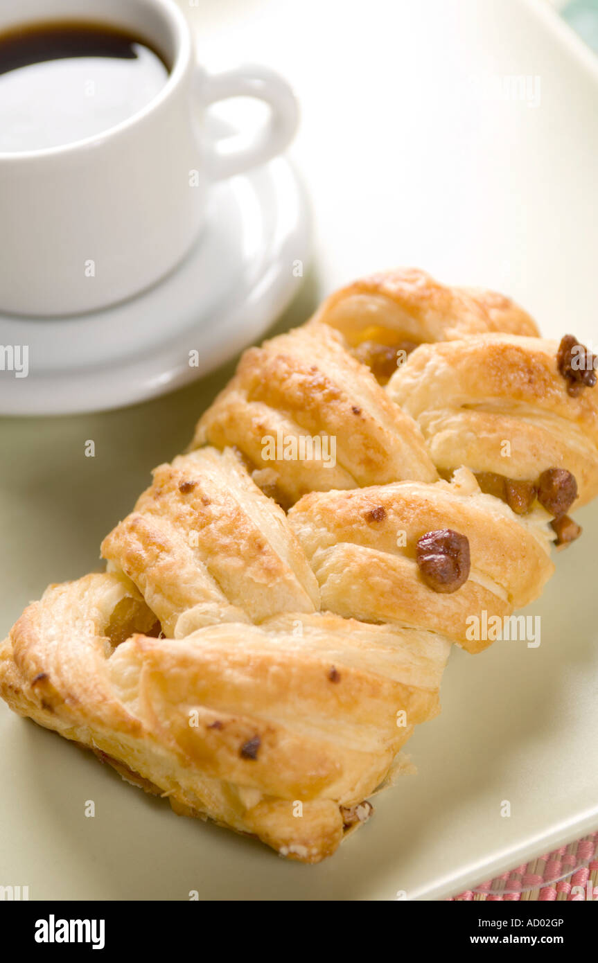 a breakfast of coffee espresso and a danish pastry Stock Photo - Alamy