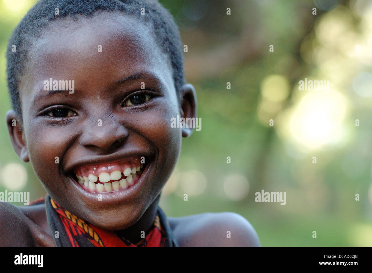 Happy African girl smiling Stock Photo - Alamy