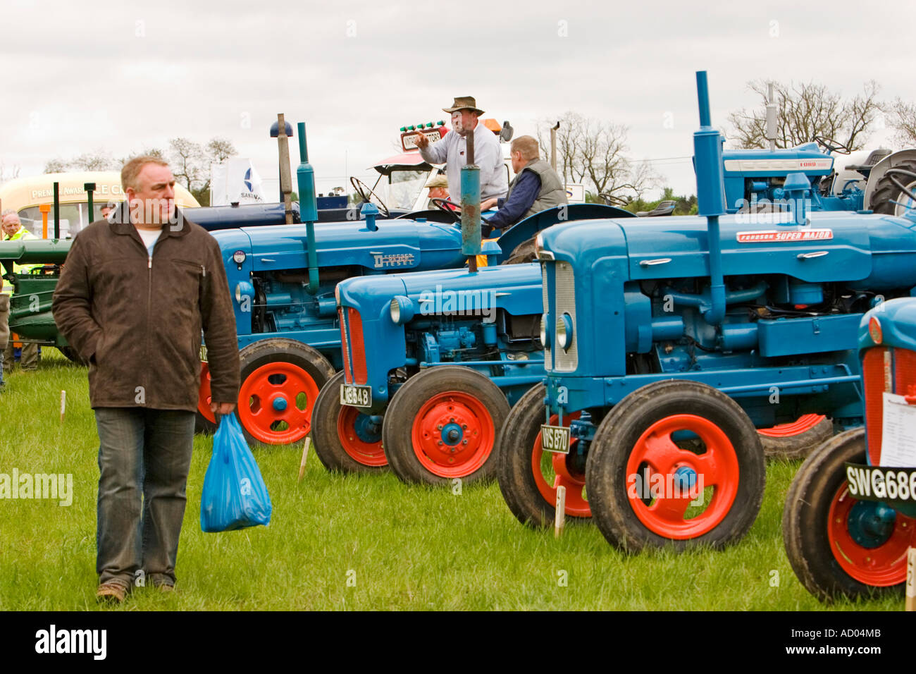 Row of restored vintage antique tractors at Scottish agricultural show ...