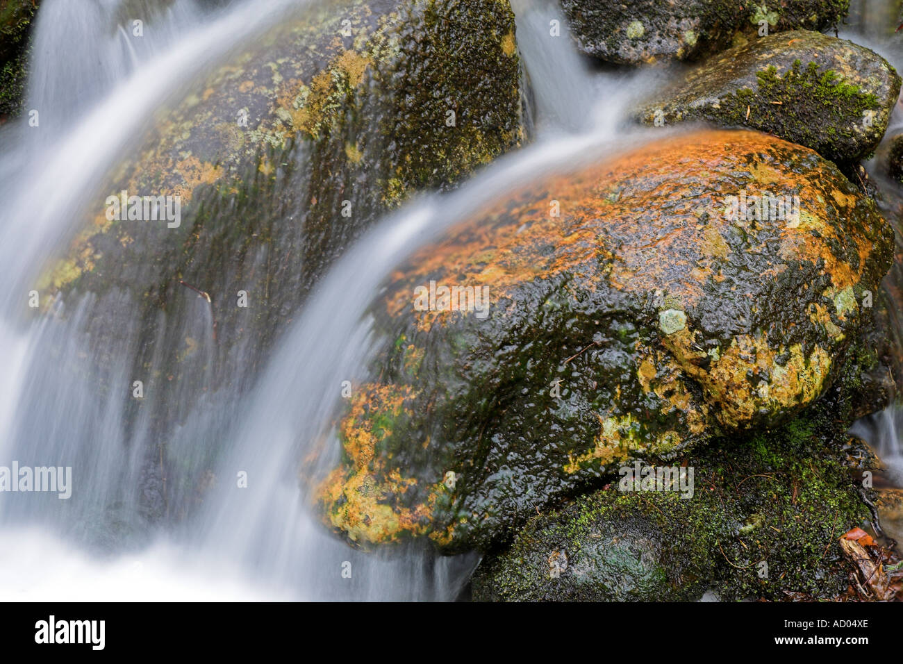 Water rushing over rocks Stock Photo - Alamy