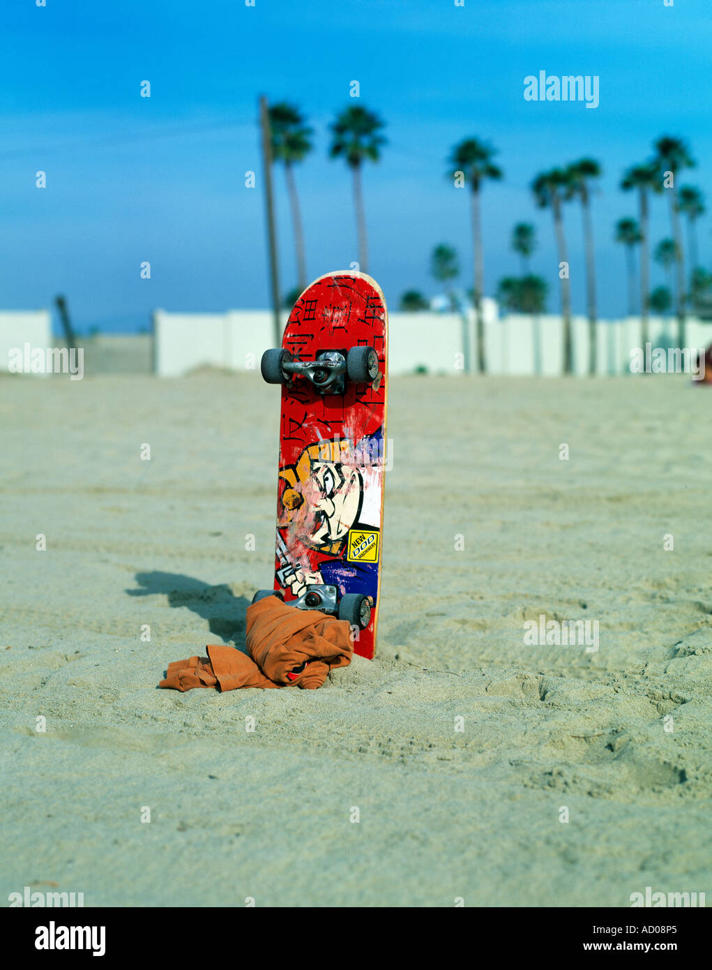 Skate board up ended into sand on beach hi-res stock photography and ...