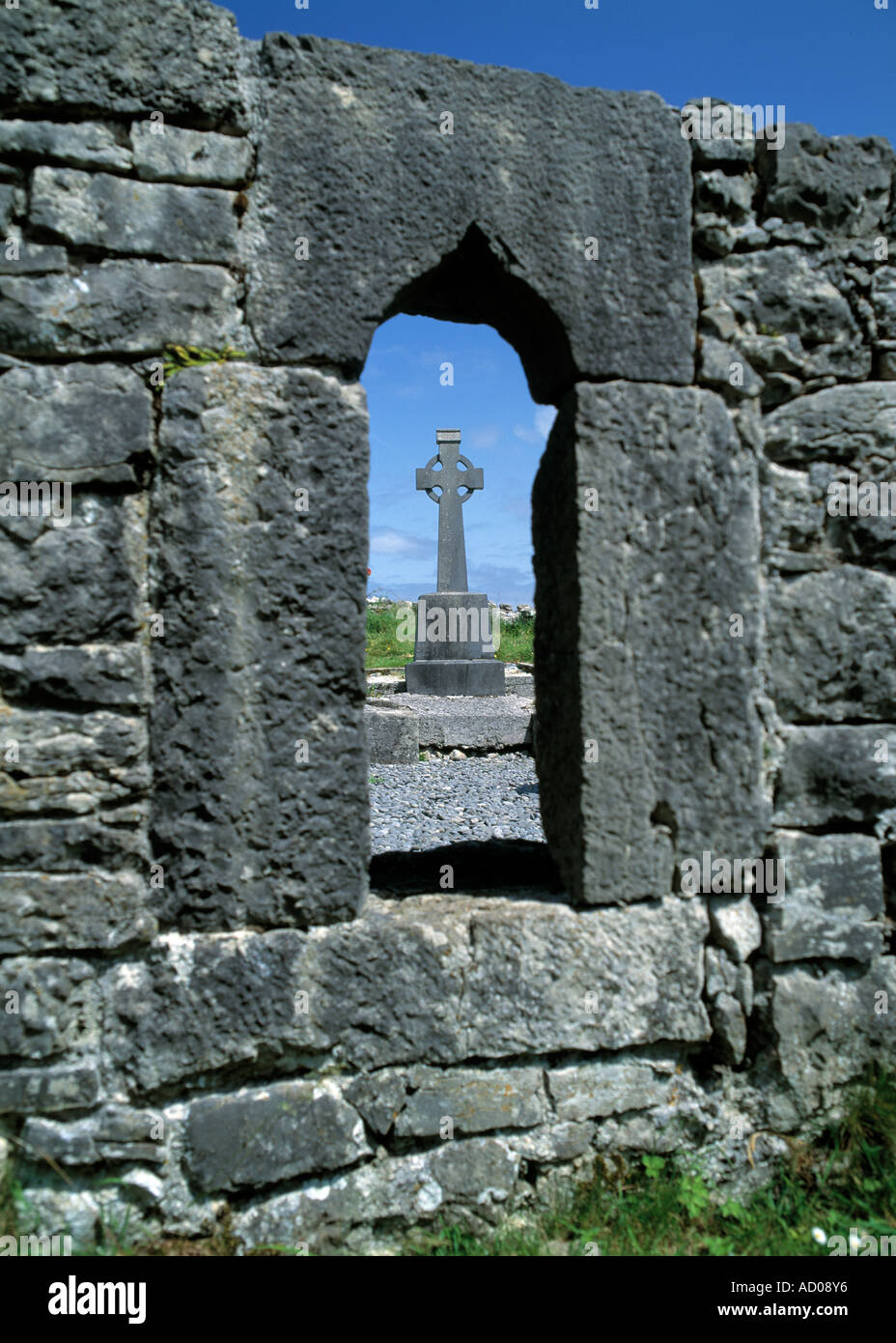 celtic cross through the window of a ruined religious building Stock ...