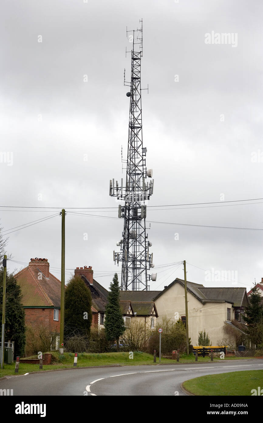 A mobile phone mast next to houses at Romsley Worcestershire UK Stock ...