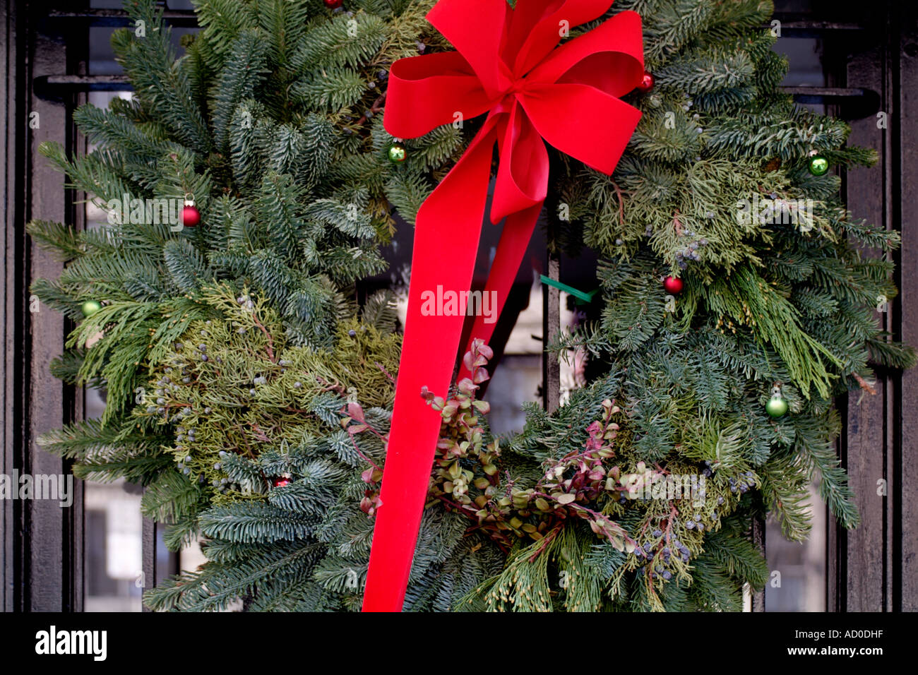 Christmas Wreath with Red Ribbon and Pine Cones on Building Gate Stock ...