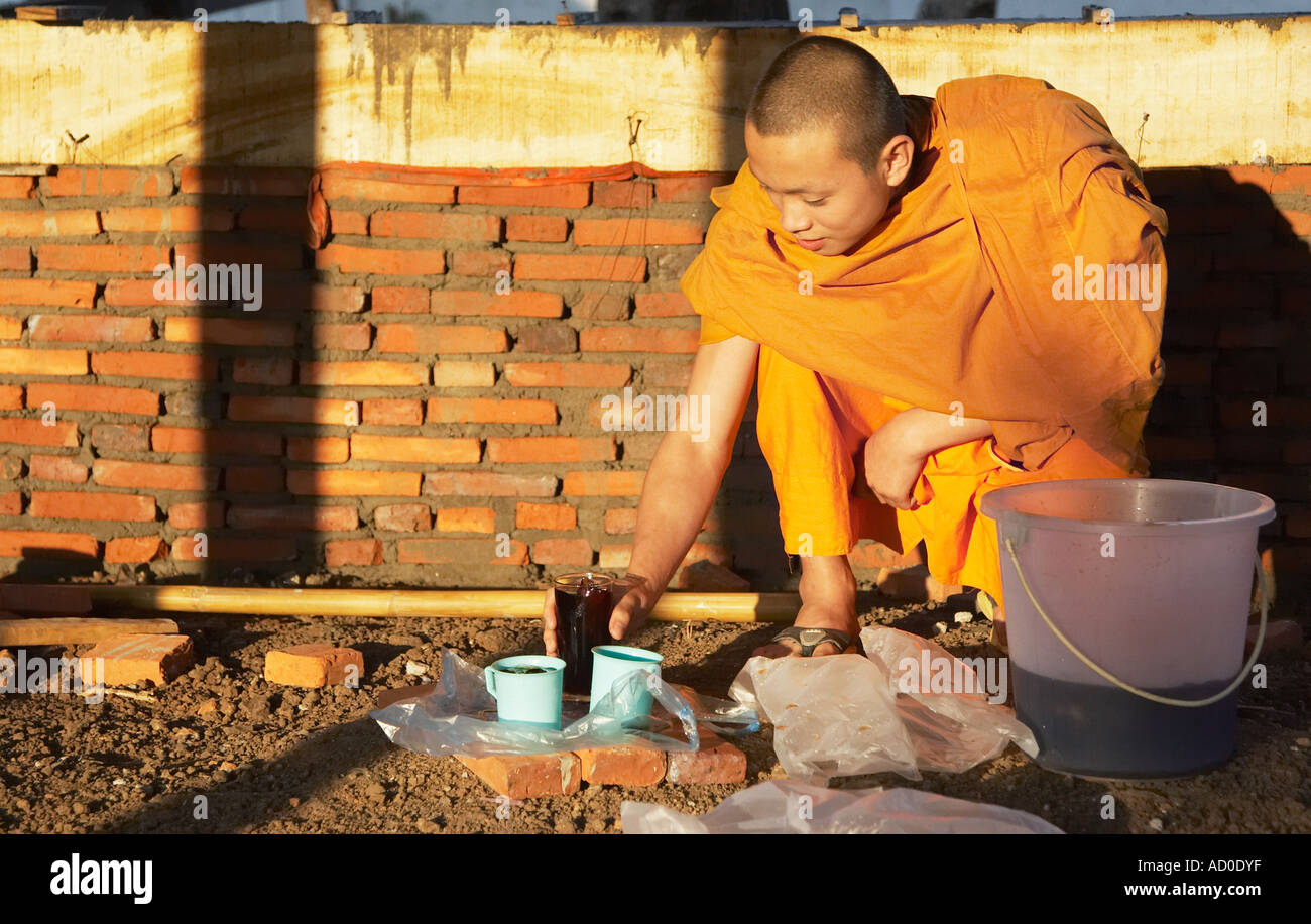 Buddhist monk drink hi-res stock photography and images - Alamy