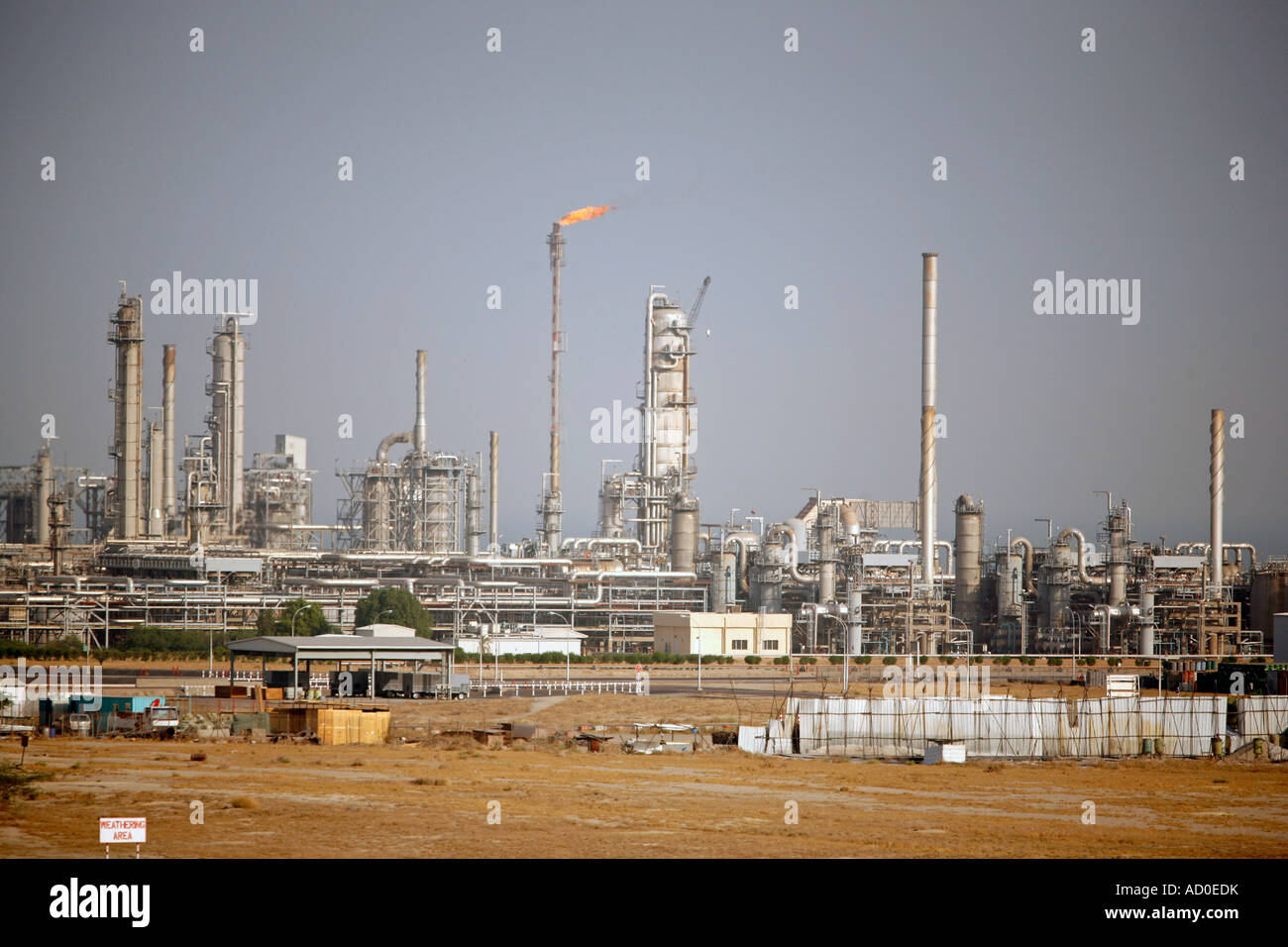 Oil refinery landscape, haze and pollution, Kuwait Stock Photo - Alamy
