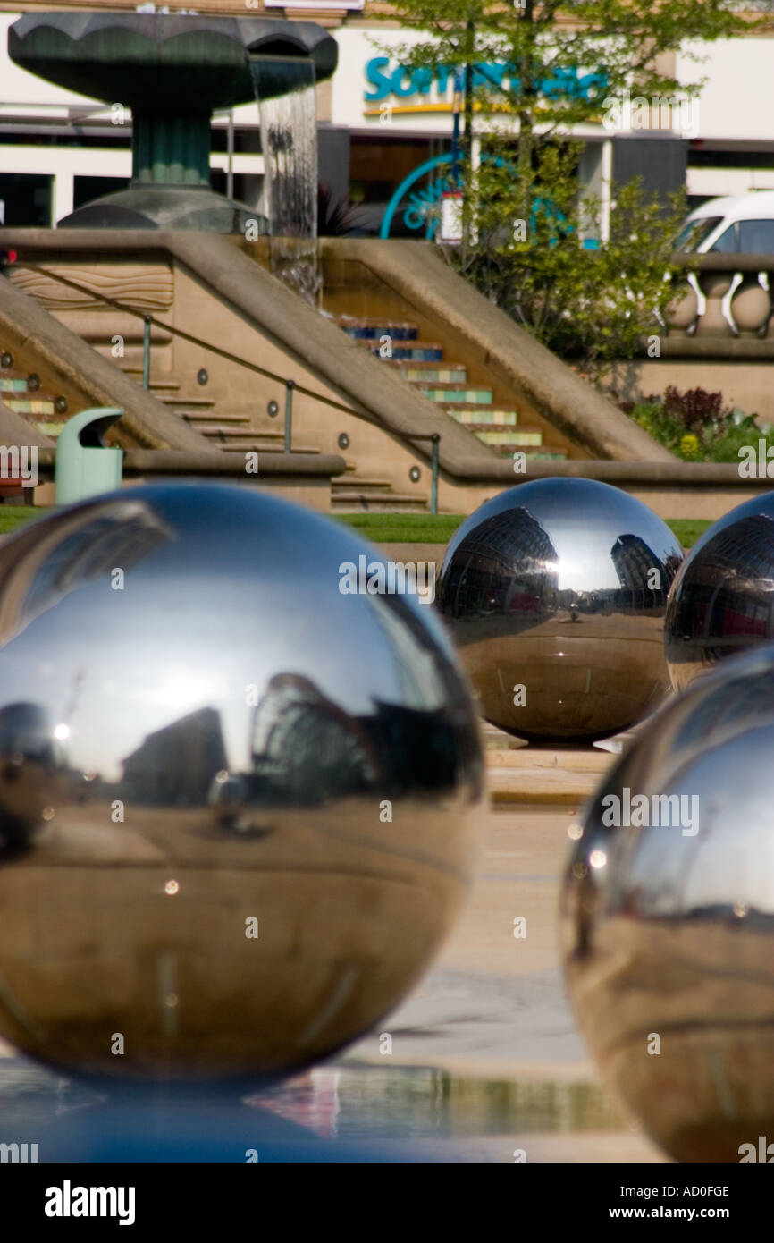 Polished steel spheres reflecting buildings around Sheffield Peace ...