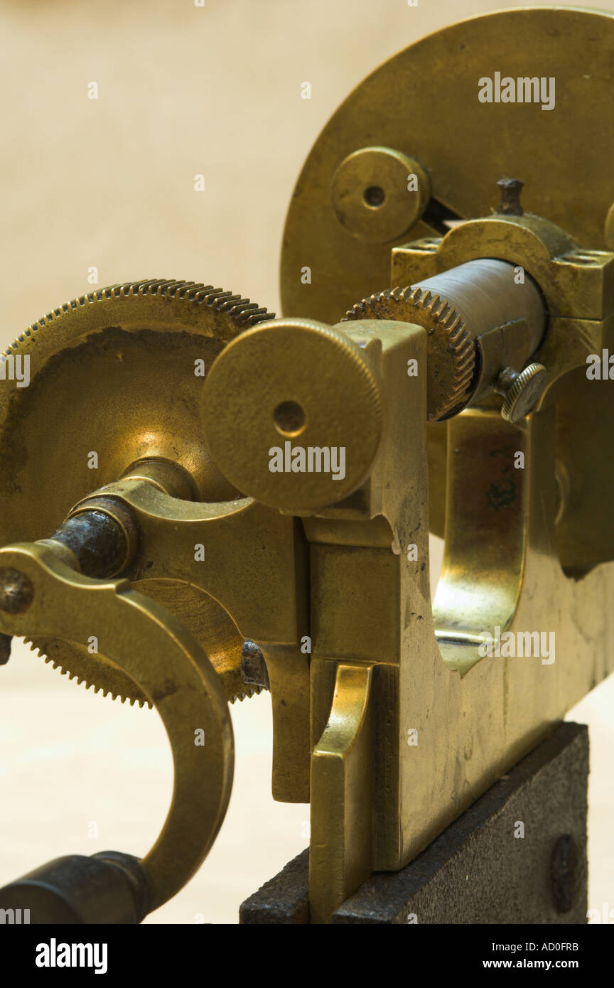 Closeup of meshing gear cogs spindle and hand crank of antique ...
