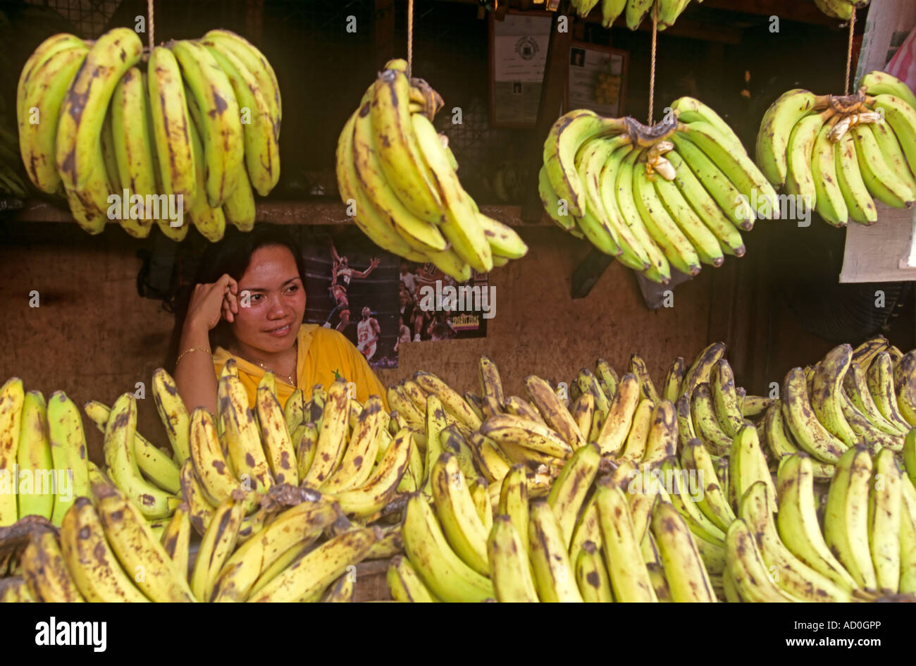 Bananas and vendor on market stall, Lucban, Philippines Stock Photo - Alamy
