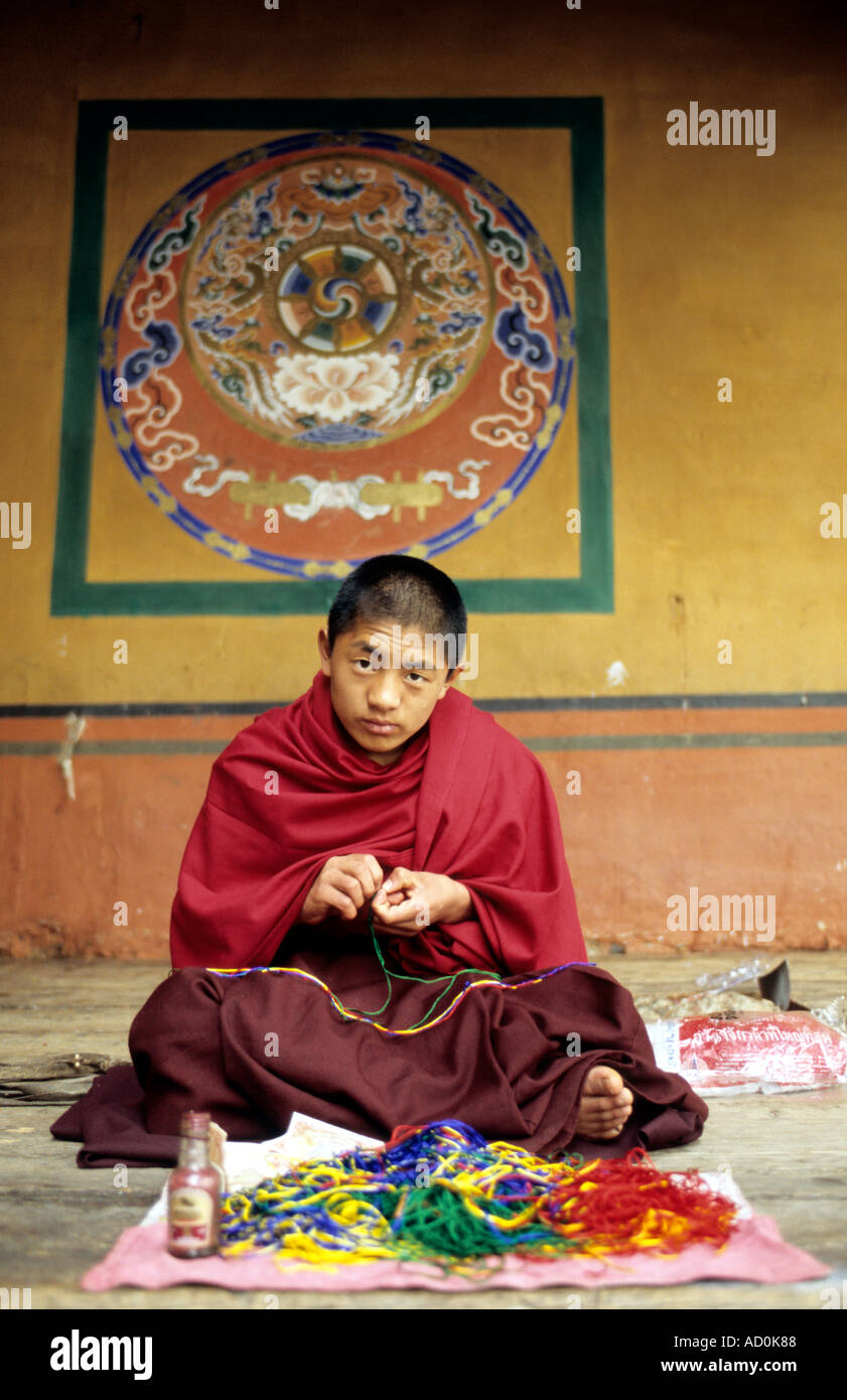 Monk threading beads paro Dzong Bhutan Stock Photo - Alamy
