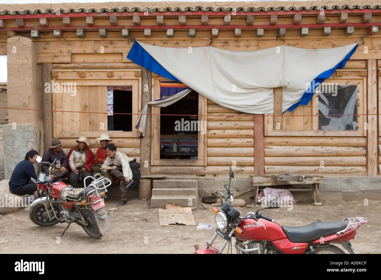 Tibetan men outside a makeshift eatery at Dzogchen village in the ...