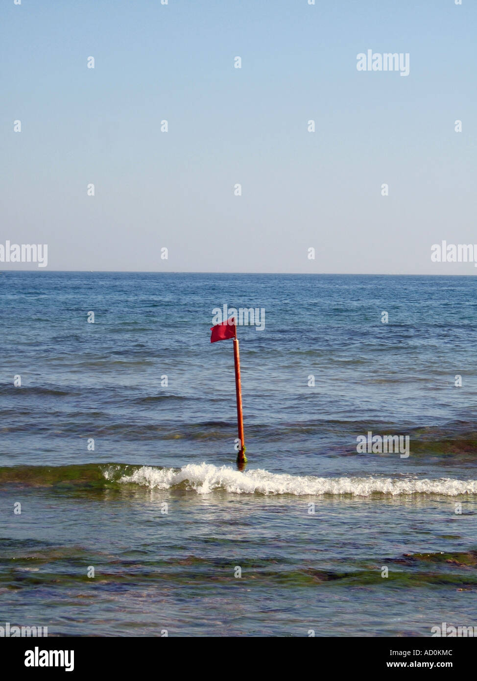 red warning flag in sea Stock Photo - Alamy