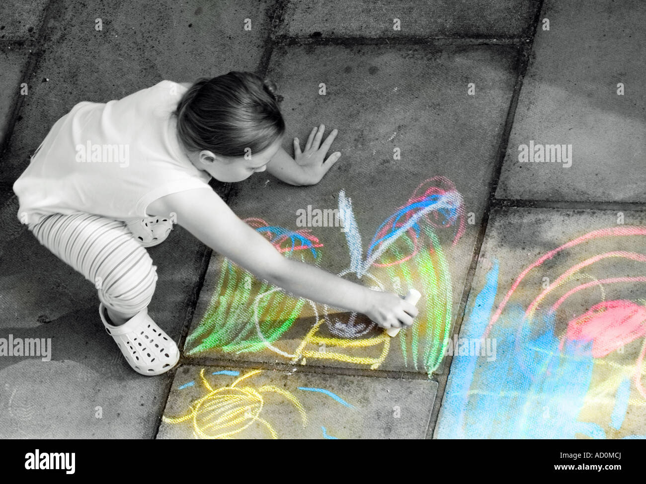 Child Drawing with Coloured Chalk Stock Photo - Alamy