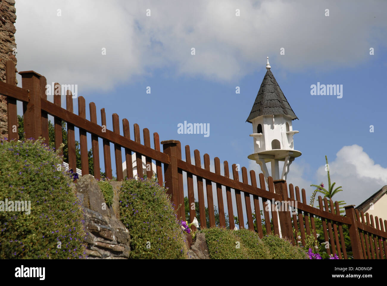 Birdhouse overlooking fence Stock Photo - Alamy