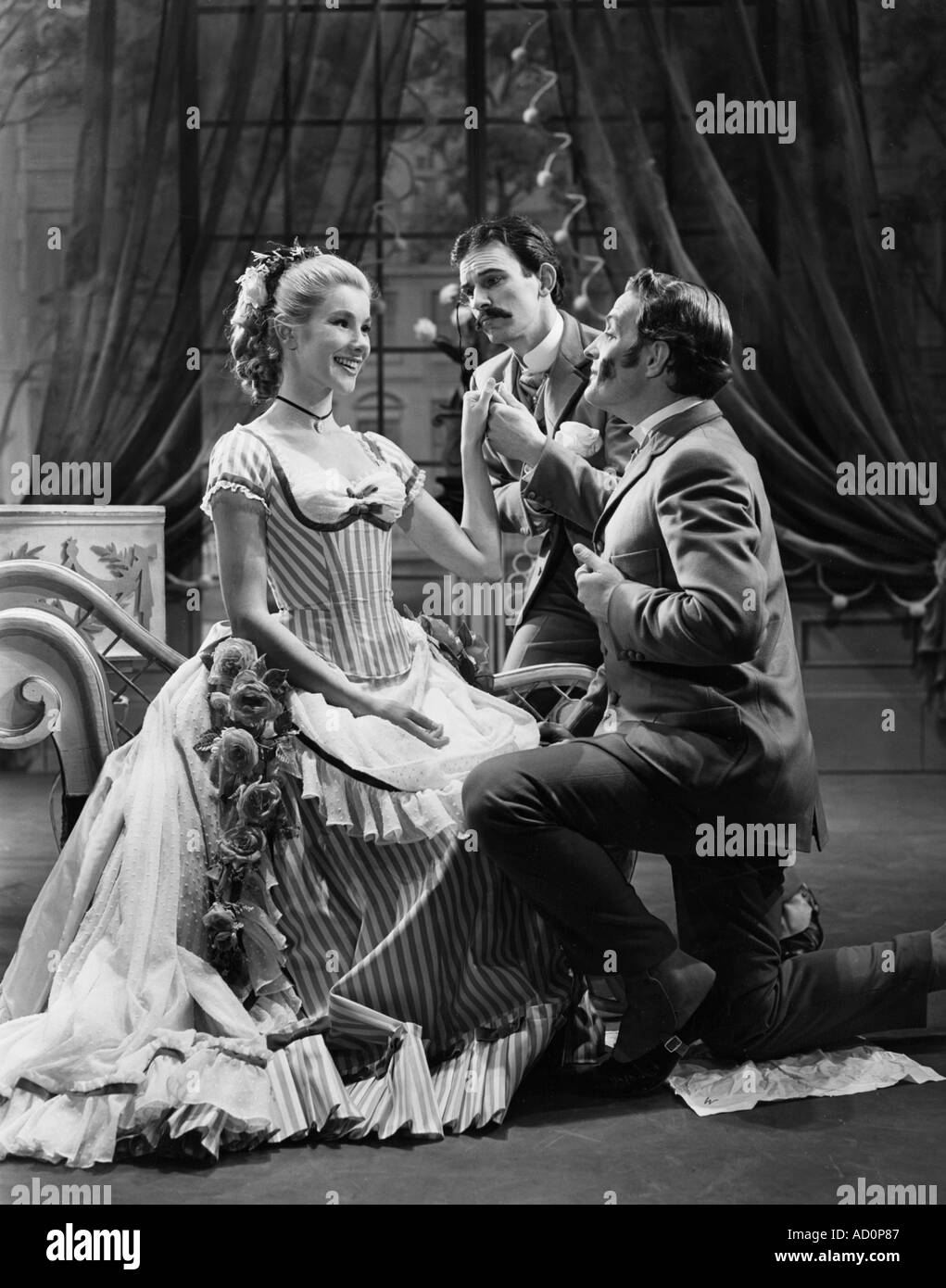 People Acting On Stage In Black And White