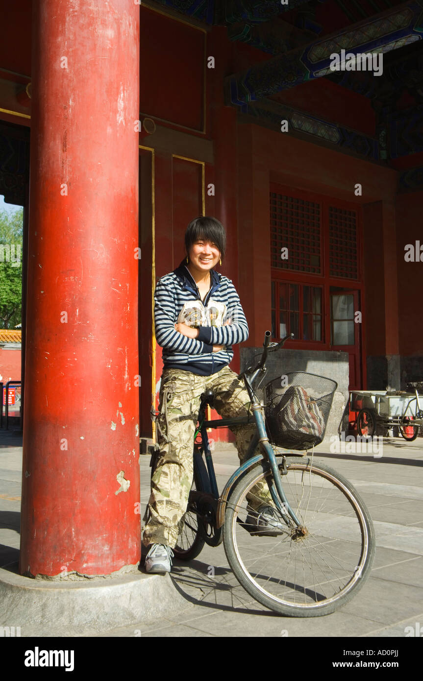 a cyclist at a gate to Zijin Cheng The Forbidden City Palace Museum ...