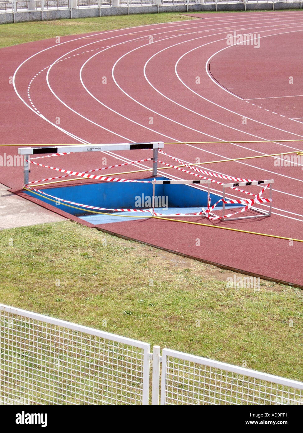 steeplechase hurdle water pit blocked with red and white tape Stock ...