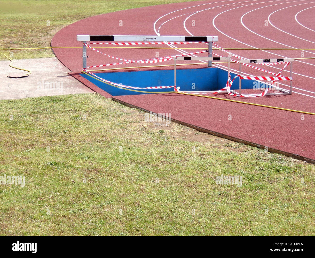 steeplechase hurdle water pit blocked with red and white tape Stock ...