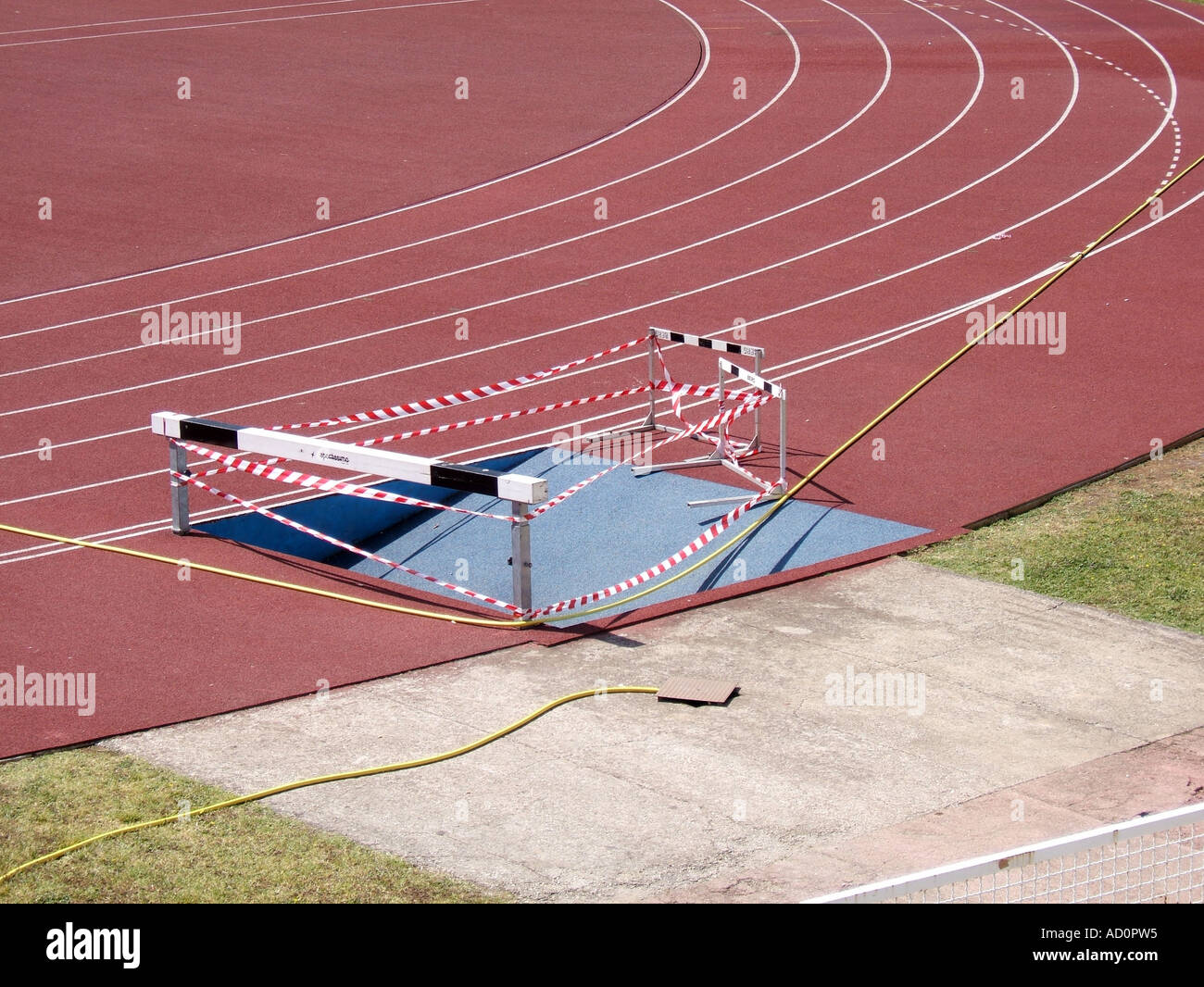 steeplechase hurdle water pit blocked with red and white tape Stock ...
