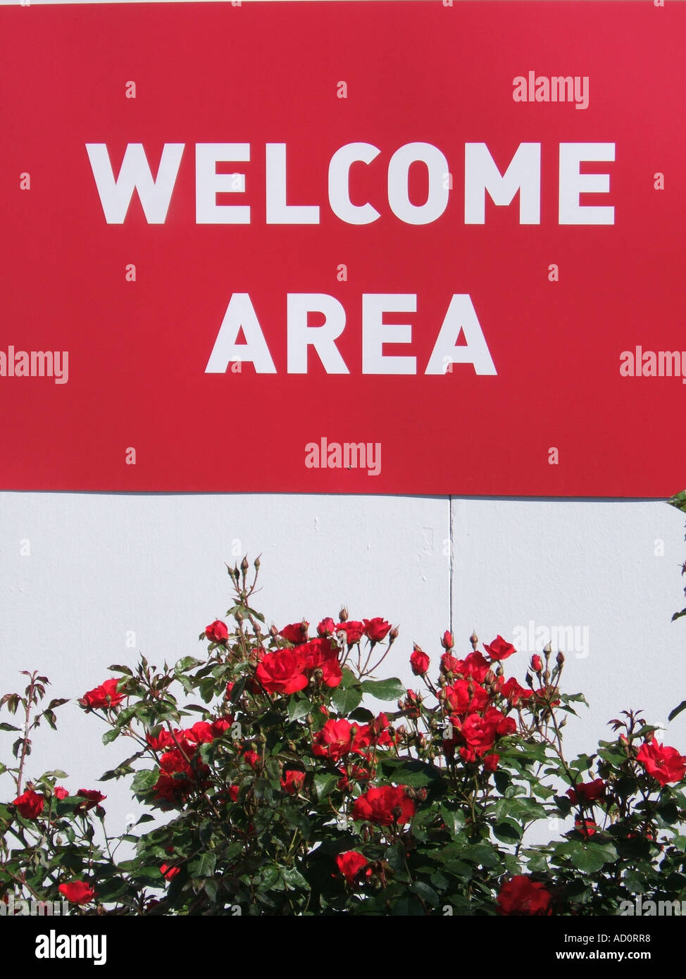 red welcome area sign at event Stock Photo - Alamy