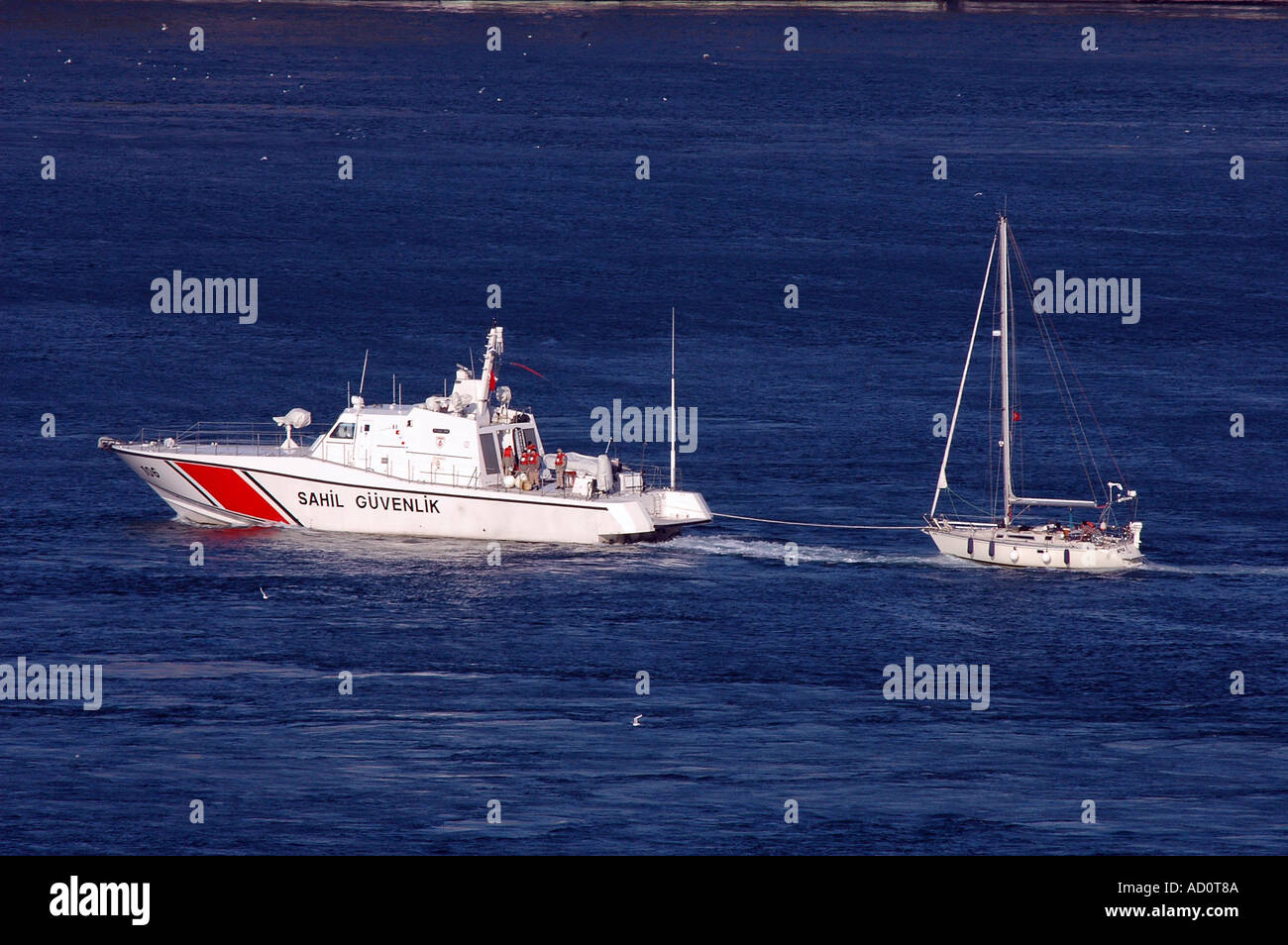 Coast guard towing a sailing boat Bosphorus Istanbul Turkey Stock Photo ...