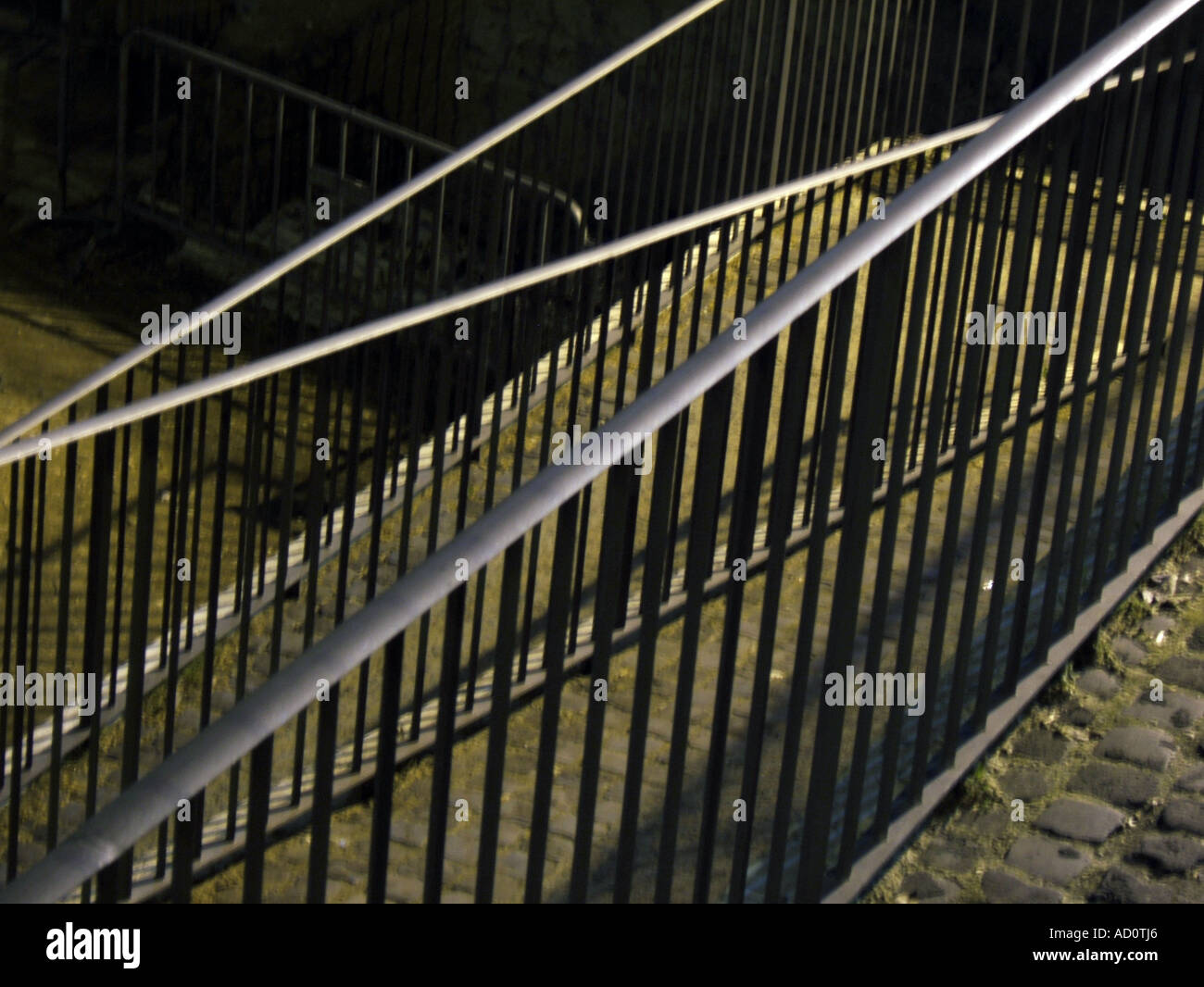 walkway with fence at night Stock Photo - Alamy