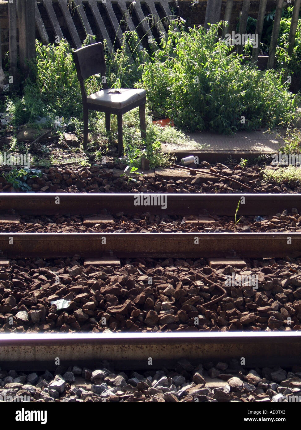old chair by railway track Stock Photo - Alamy