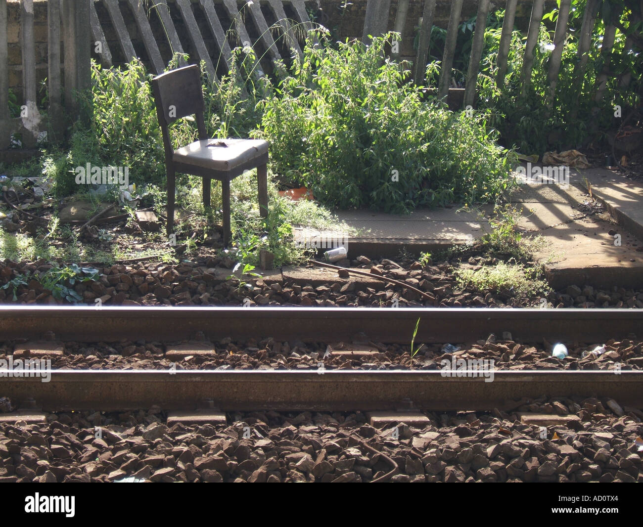 old chair by railway track Stock Photo - Alamy