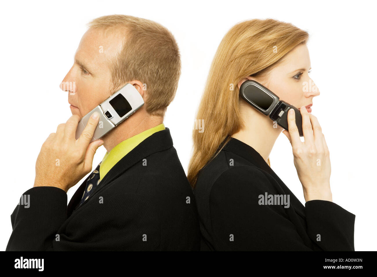 Two business people use cell phones Stock Photo - Alamy