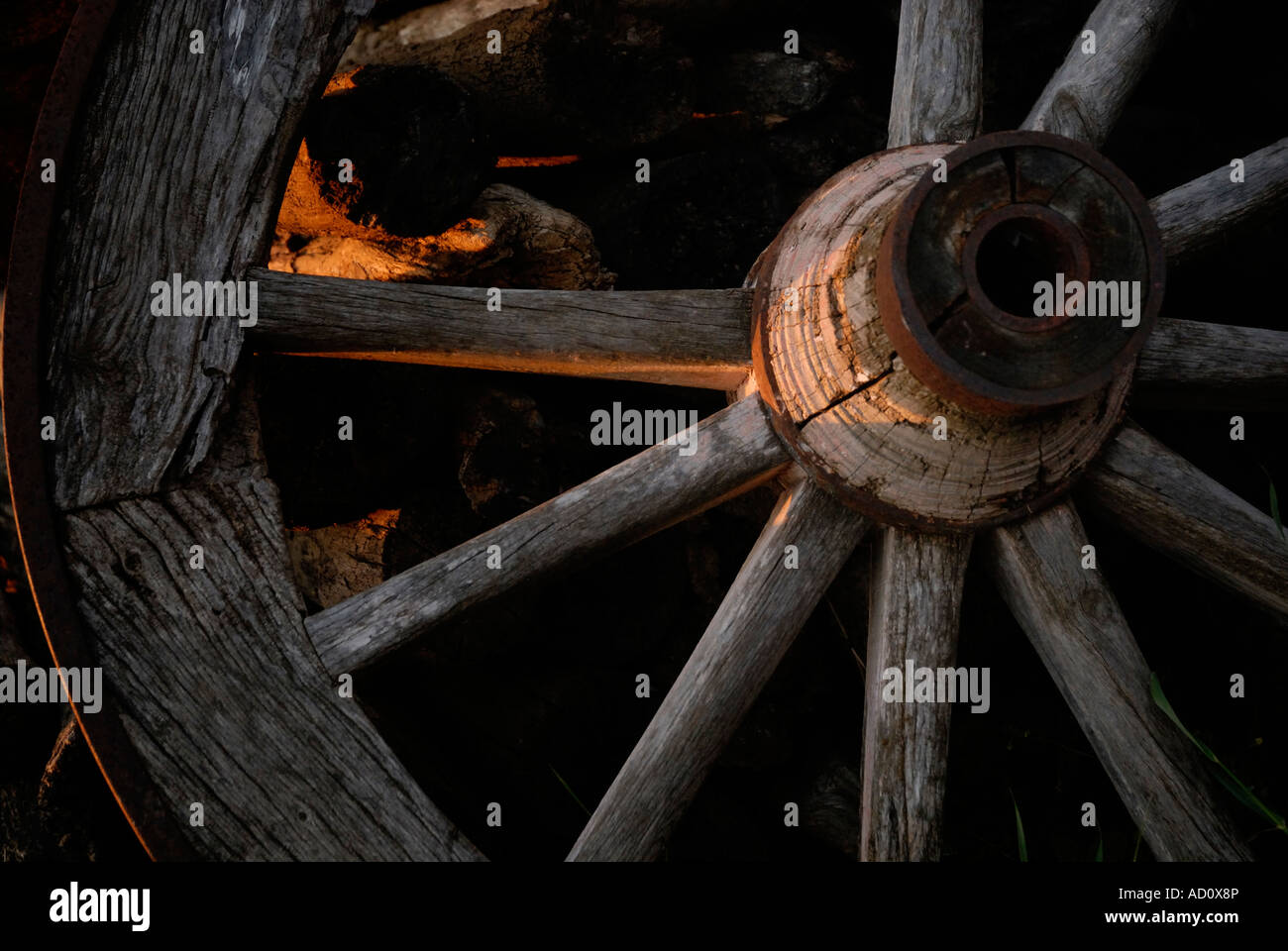 Broken cart wheel with missing spoke and logs on a farm at Paciano in ...