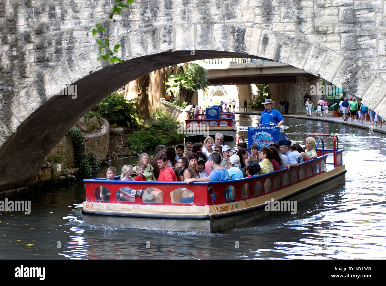 SAT Riverwalk barge under bridge Stock Photo - Alamy