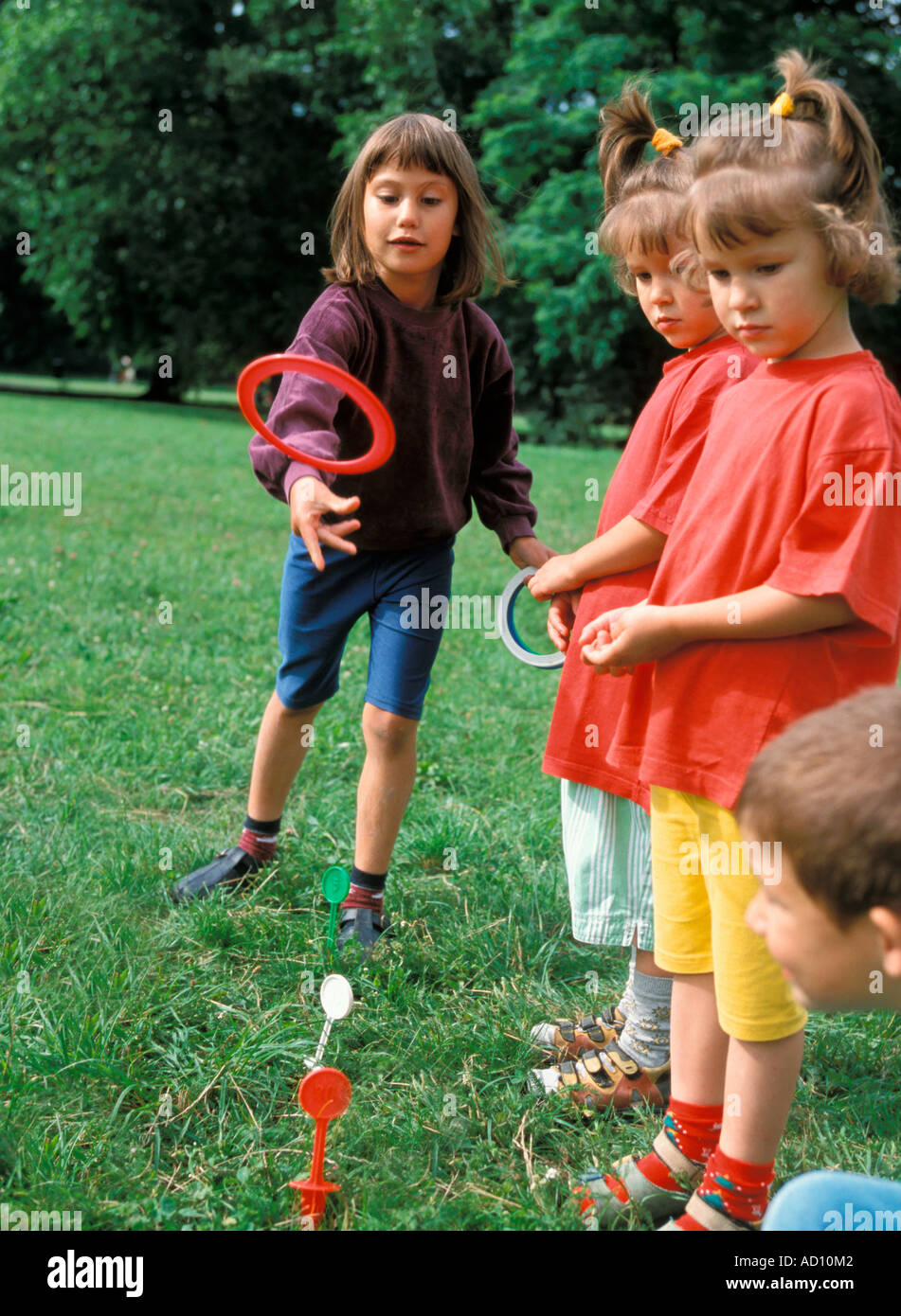 children playing with circles MR8373 MR8371 MR8372 Stock Photo - Alamy